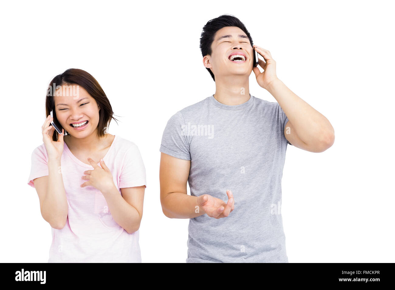 Young couple talking on mobile phone Stock Photo - Alamy