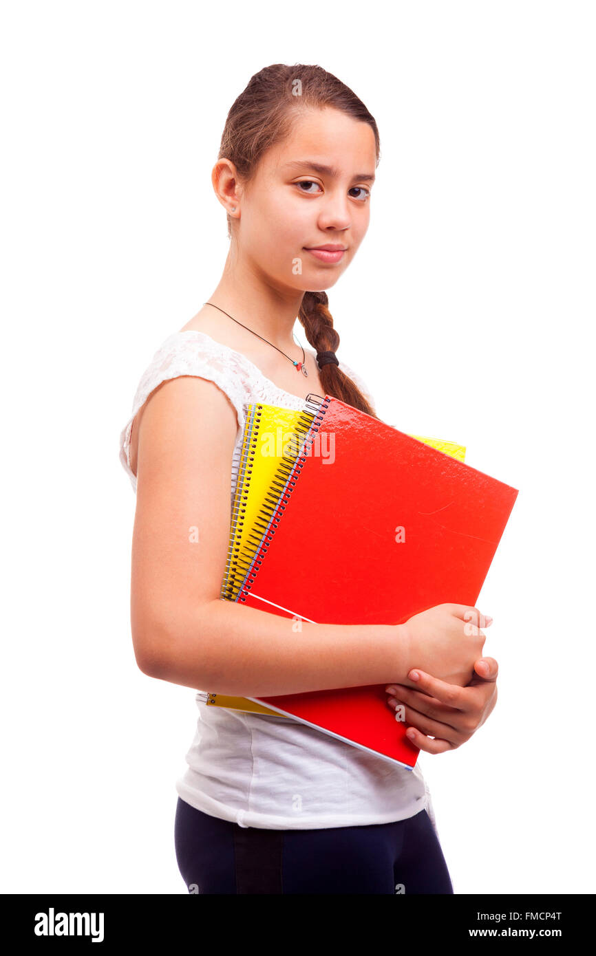 Cute teen girl holding notebooks on white background Stock Photo - Alamy