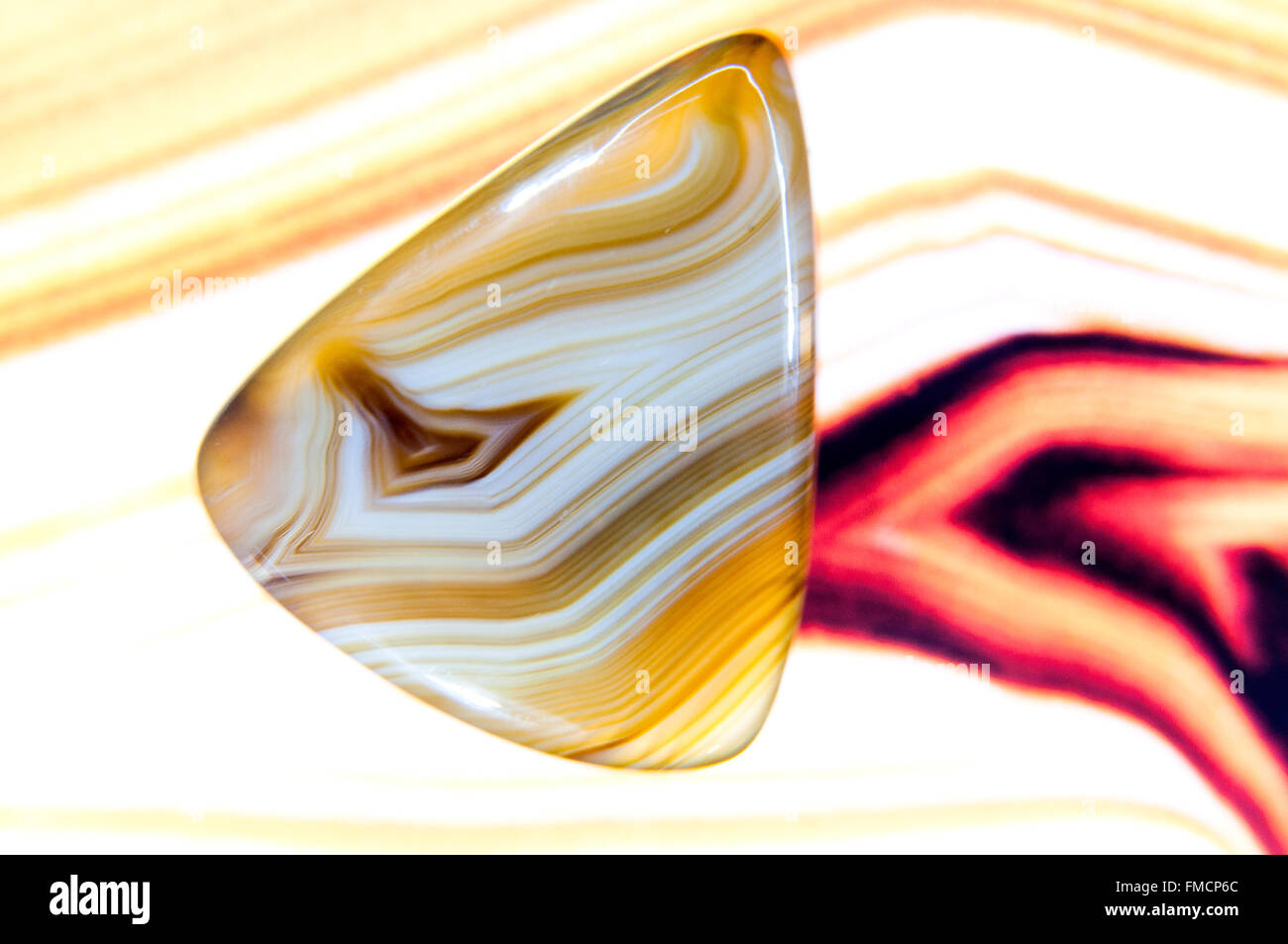 Natural banded agate mineral stone in studio setting Stock Photo - Alamy
