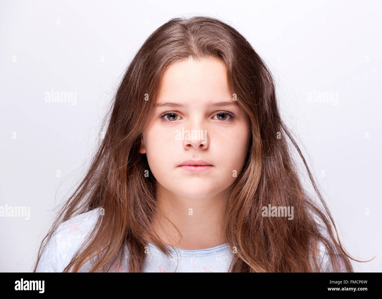 Sad girl on grey background Stock Photo - Alamy