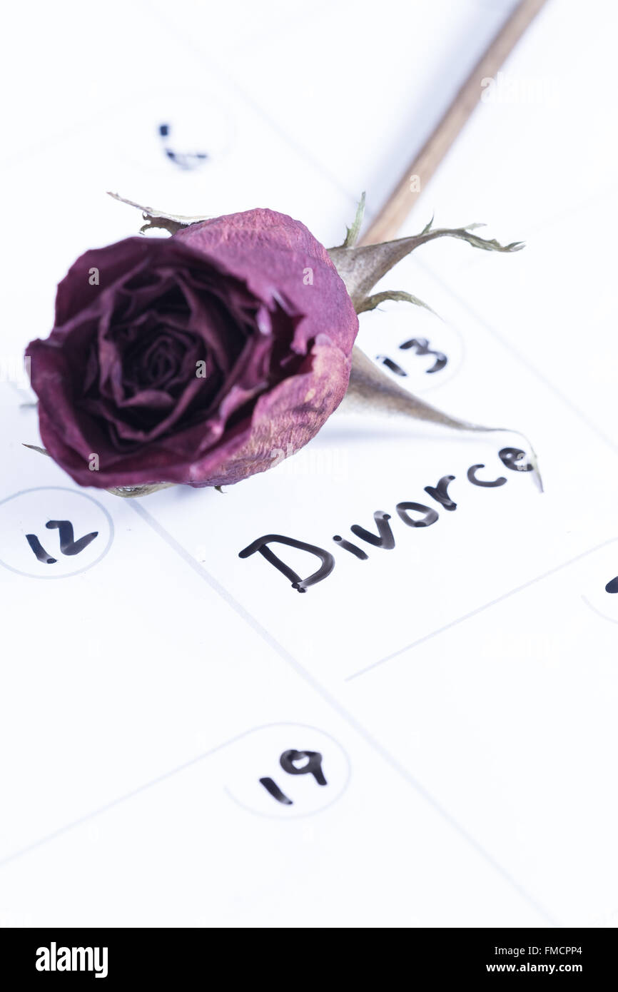 close up concept image for a divorce using a dry erase calendar and a ...