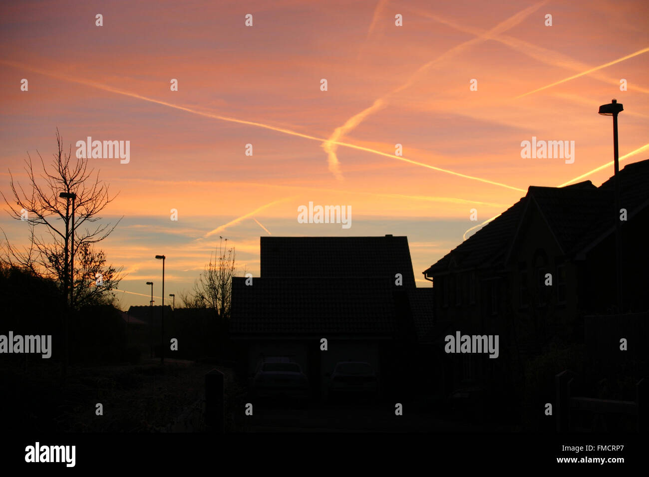 Contrails at sunset hi-res stock photography and images - Alamy