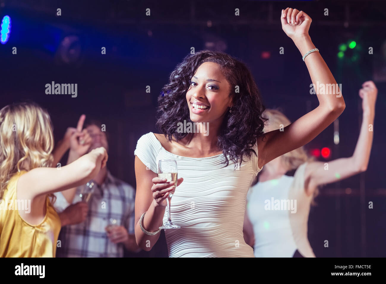 Happy friends dancing Stock Photo - Alamy