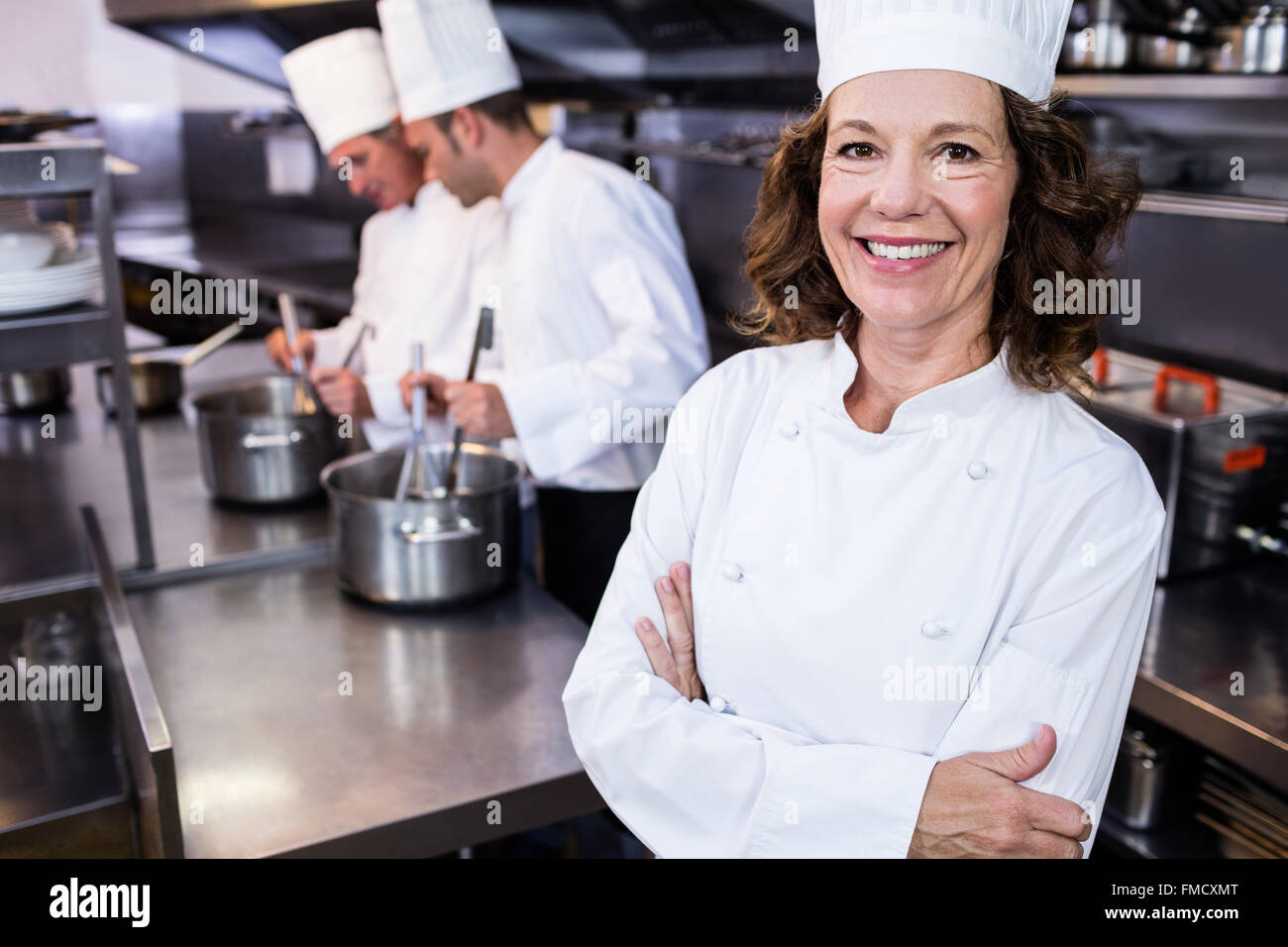 Portrait of smiling chef in commercial kitchen Stock Photo - Alamy
