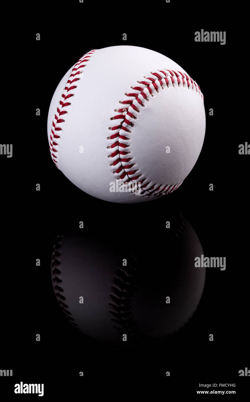 Baseball on black background Stock Photo - Alamy