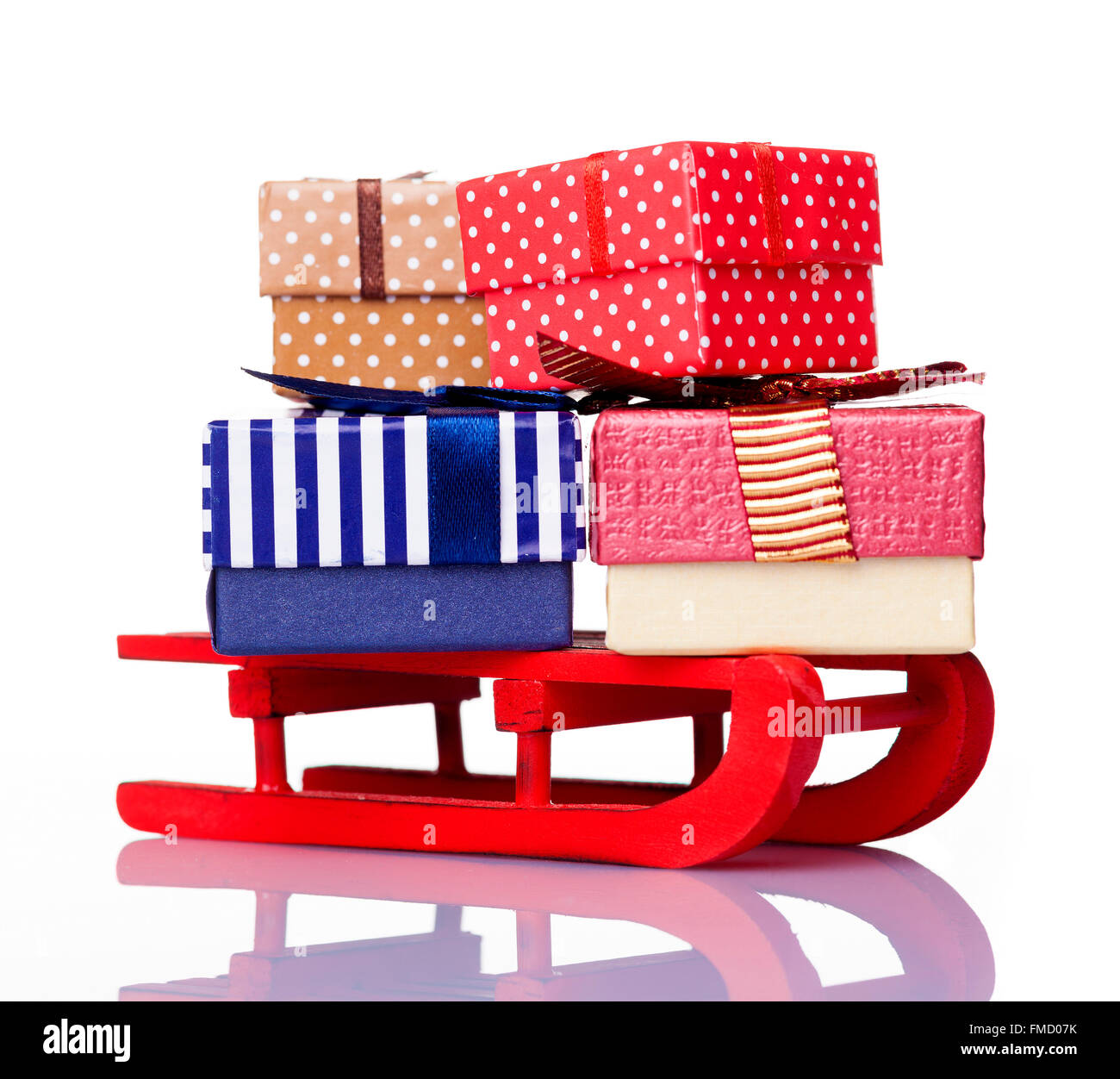 Red sled full of gift boxes, isolated on white background Stock Photo ...