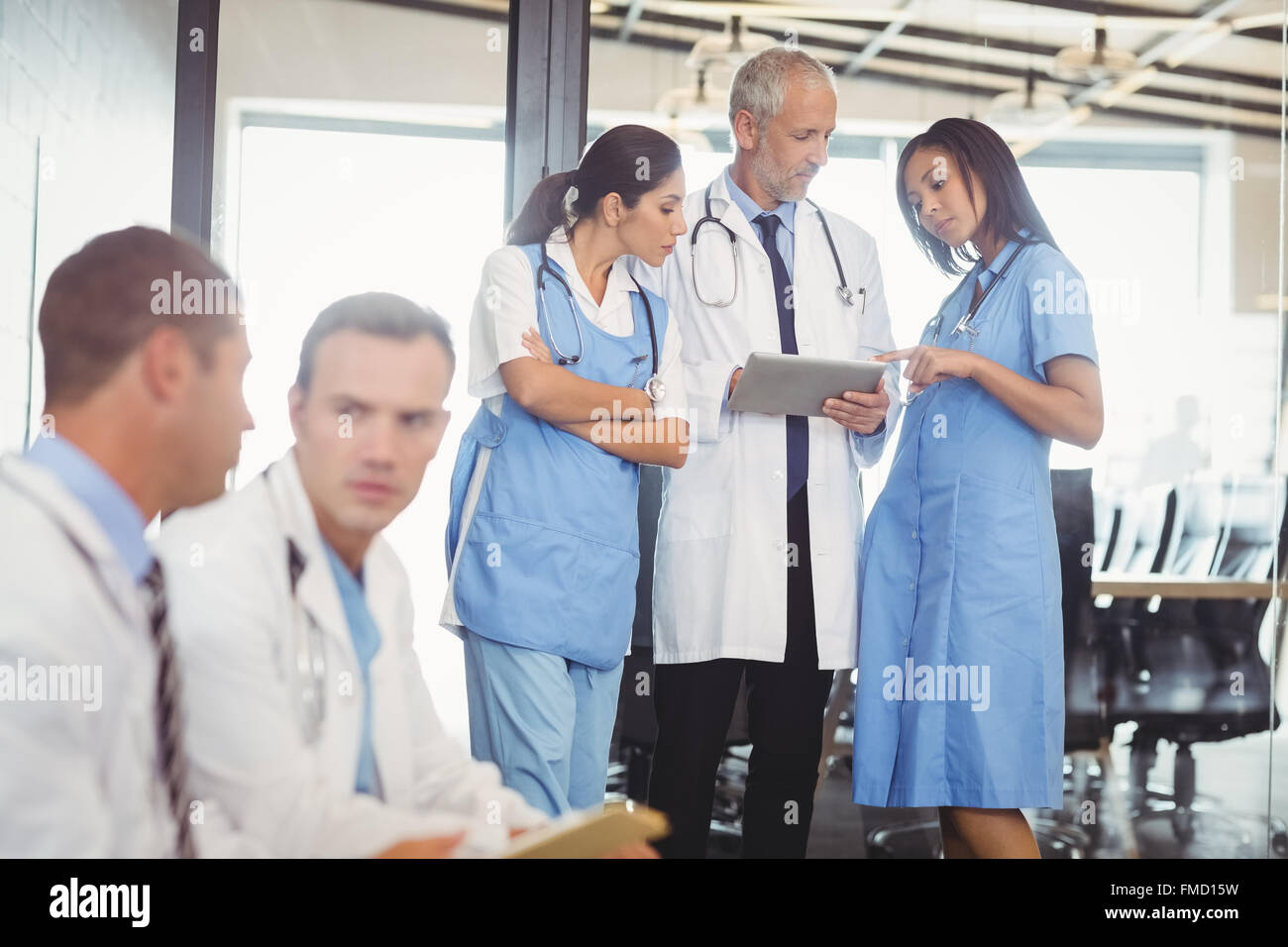 Group of doctors discussing in hospital Stock Photo - Alamy