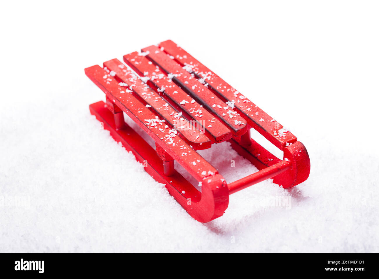 Red sled with snow isolated on white background Stock Photo - Alamy