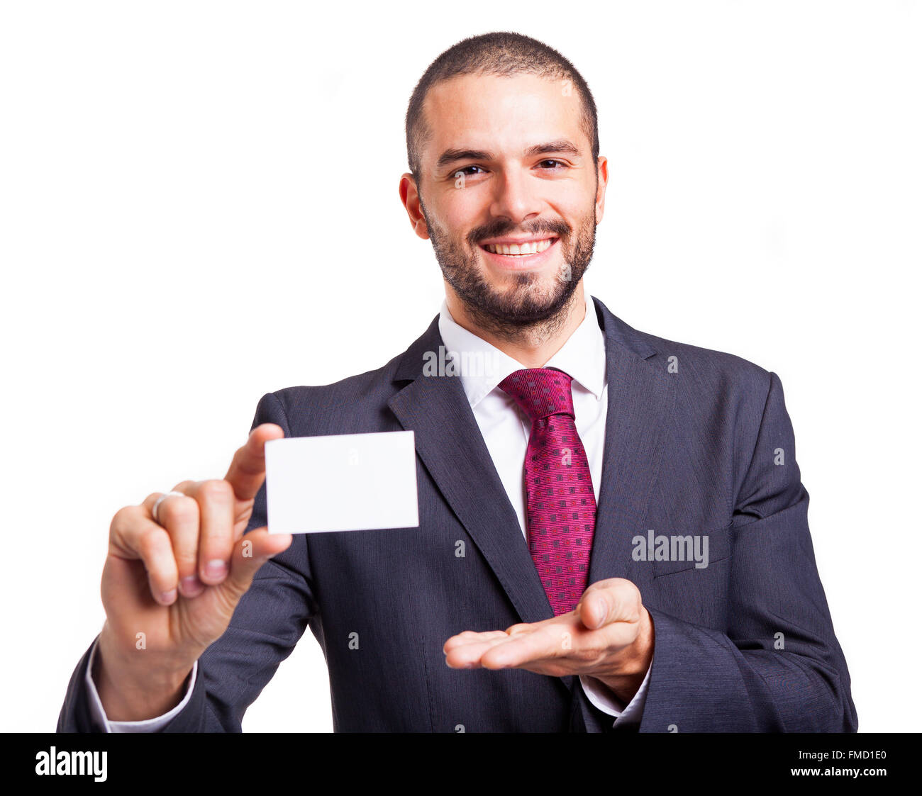 Smiling business man showing business card, isolated on white ...