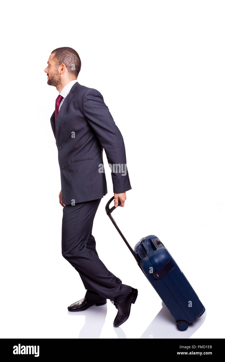 Business man walking with suitcase on white background Stock Photo - Alamy
