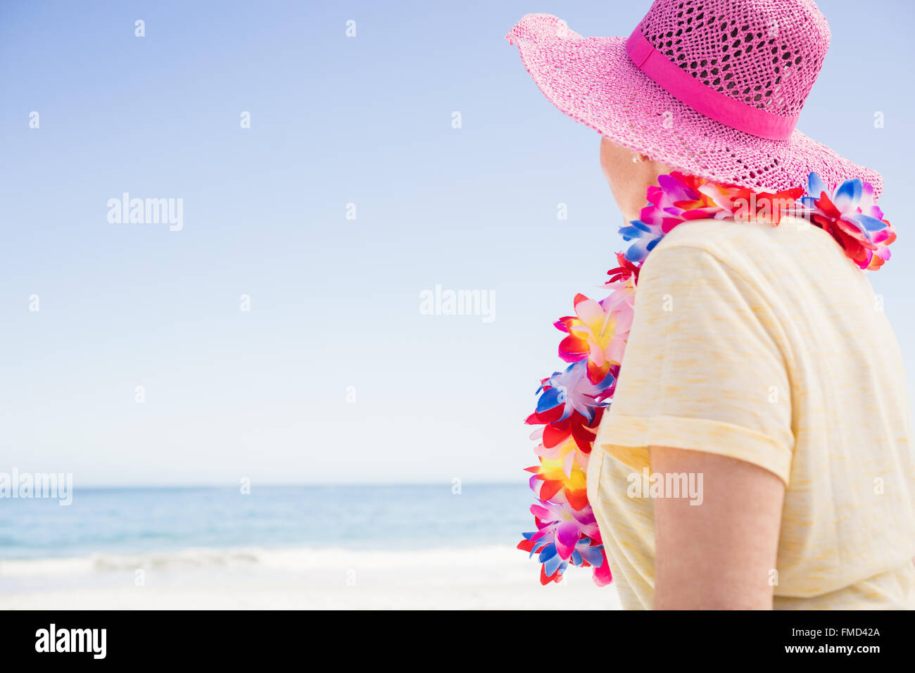 Senior woman looking at the beach Stock Photo - Alamy