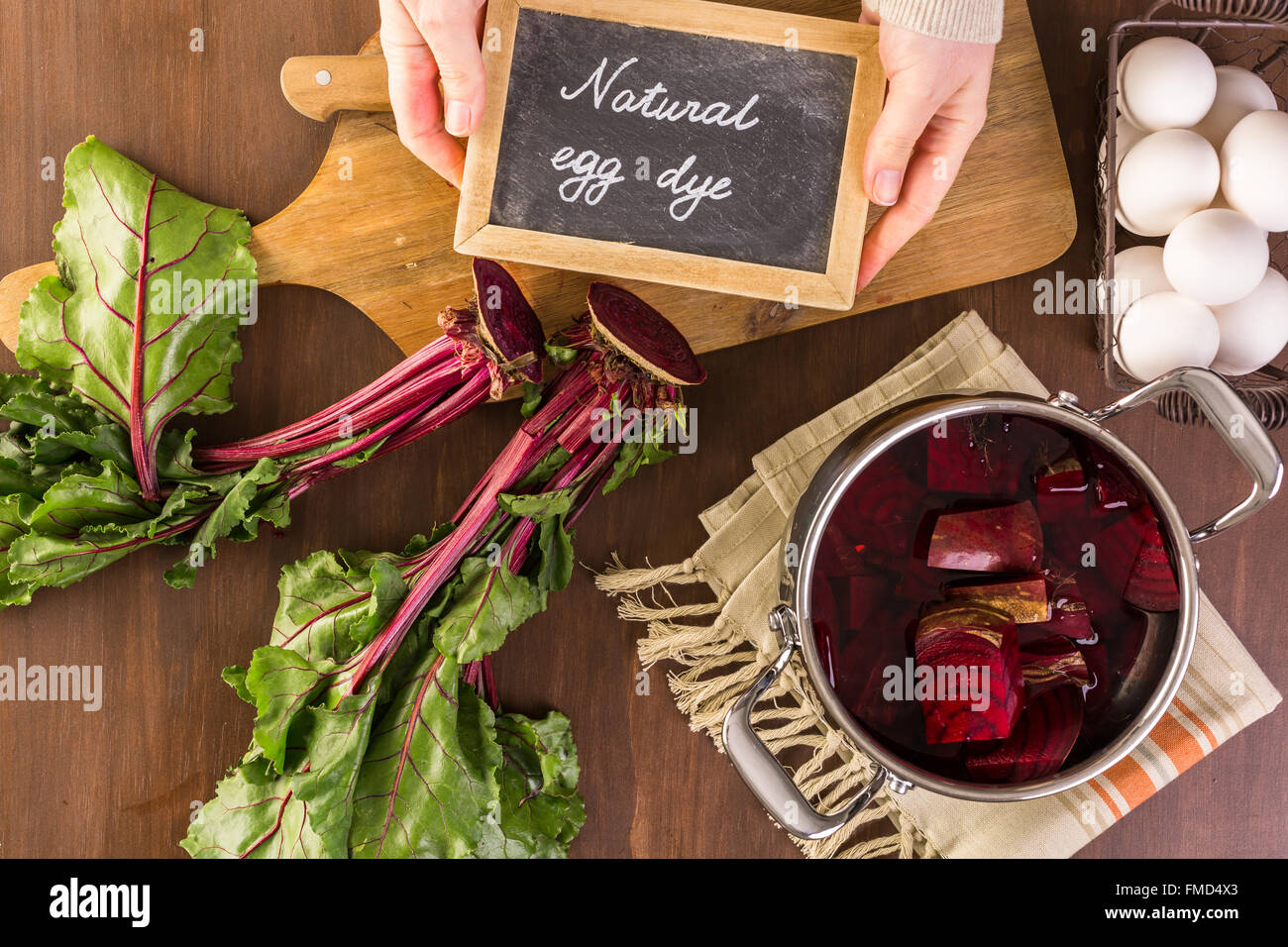 Dyeing Easter eggs with natural dye colors Stock Photo - Alamy