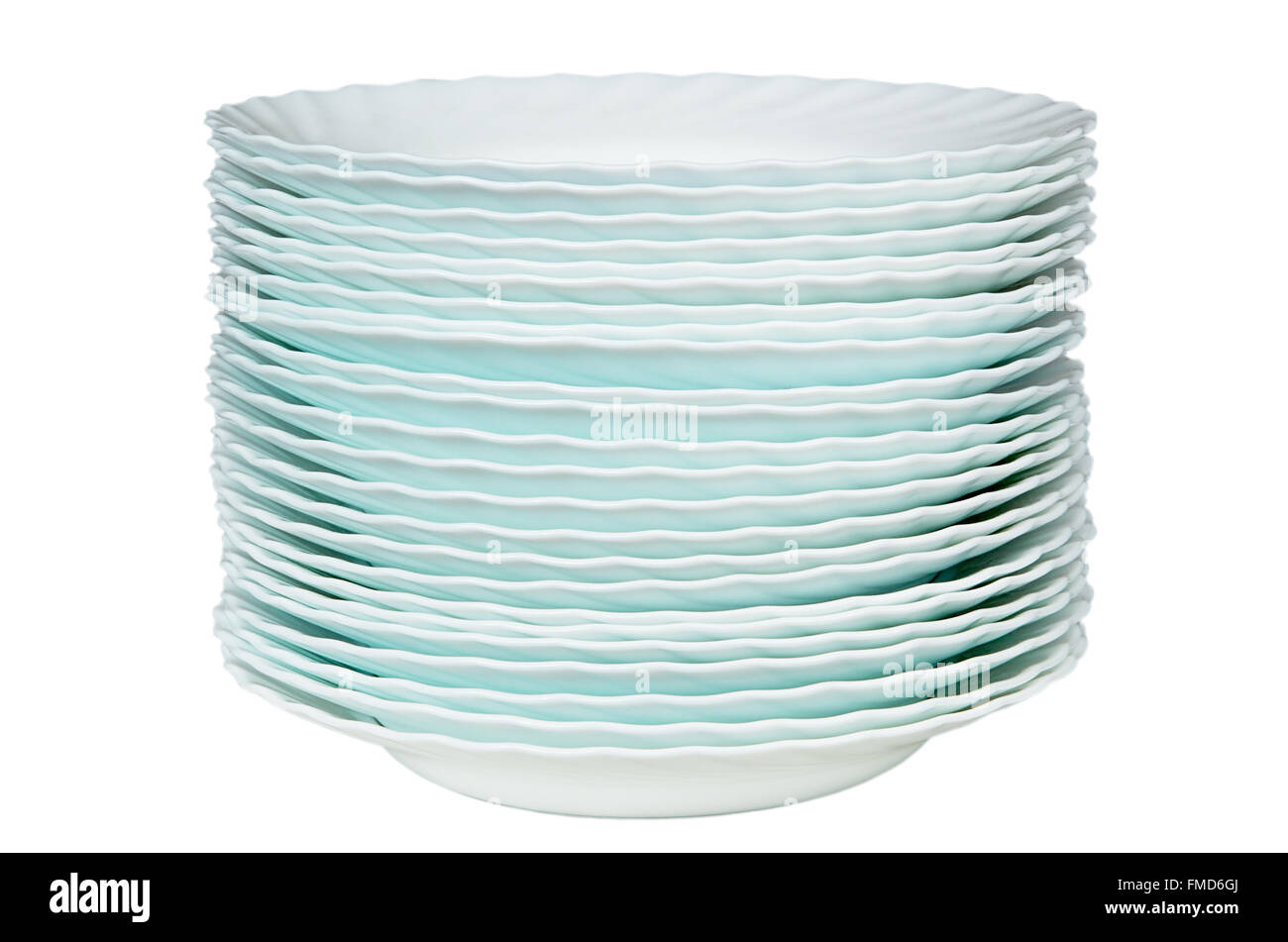 Beautiful white plates on a white background Stock Photo - Alamy