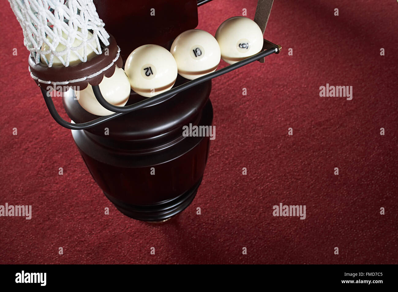 balls in a billiard pocket on a red background Stock Photo - Alamy
