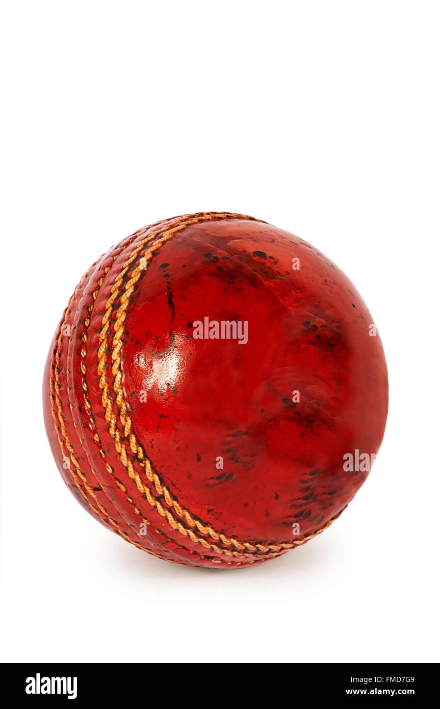 Red ball for cricket on a white background Stock Photo - Alamy