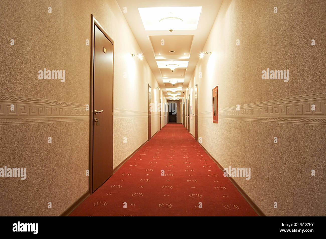 Beautiful and long corridor in modern hotel Stock Photo - Alamy