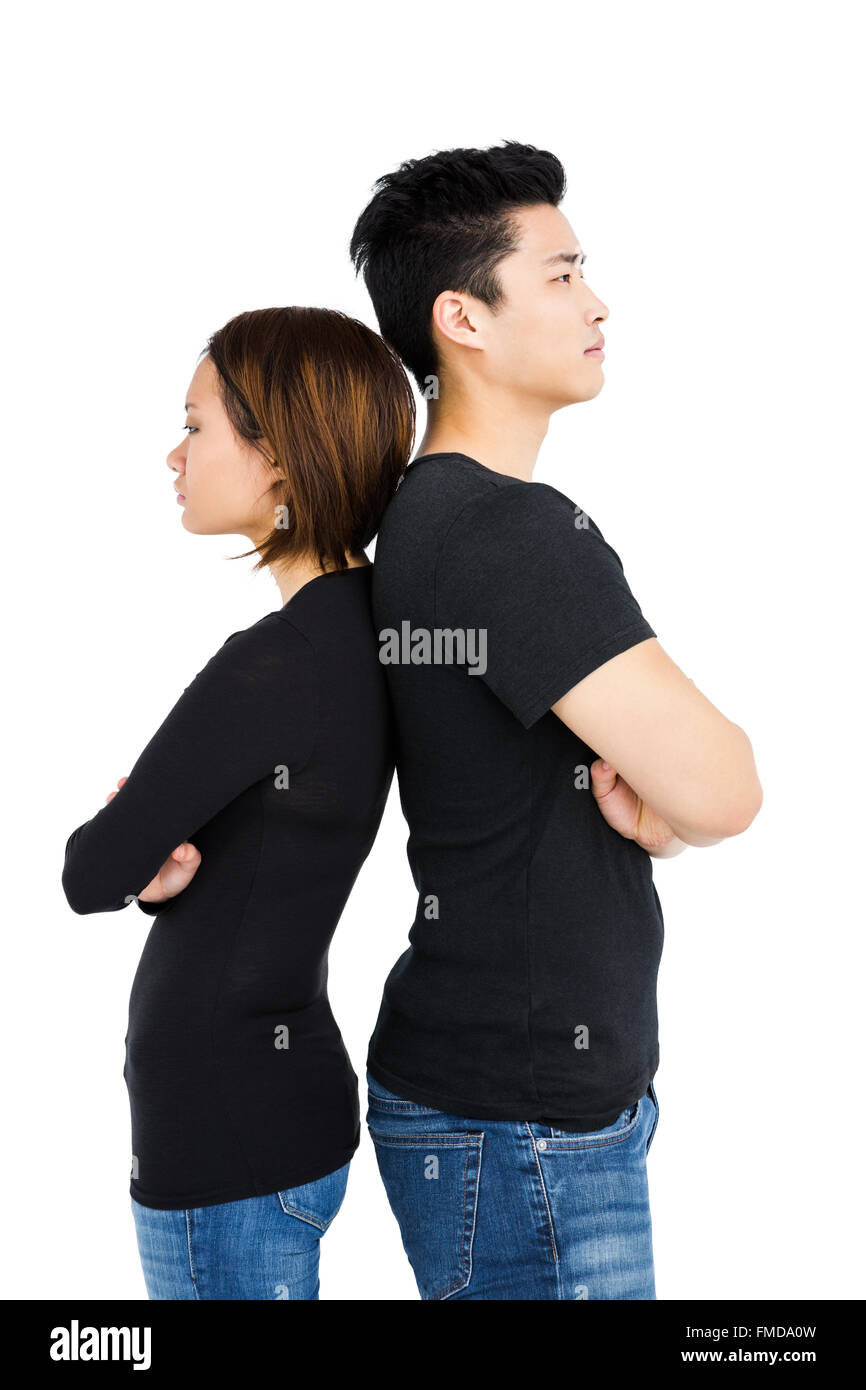 Depressed couple standing back to back Stock Photo - Alamy