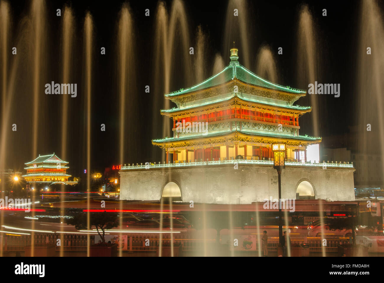 Xi'an Bell Tower, China photographed at night in front of water spray ...