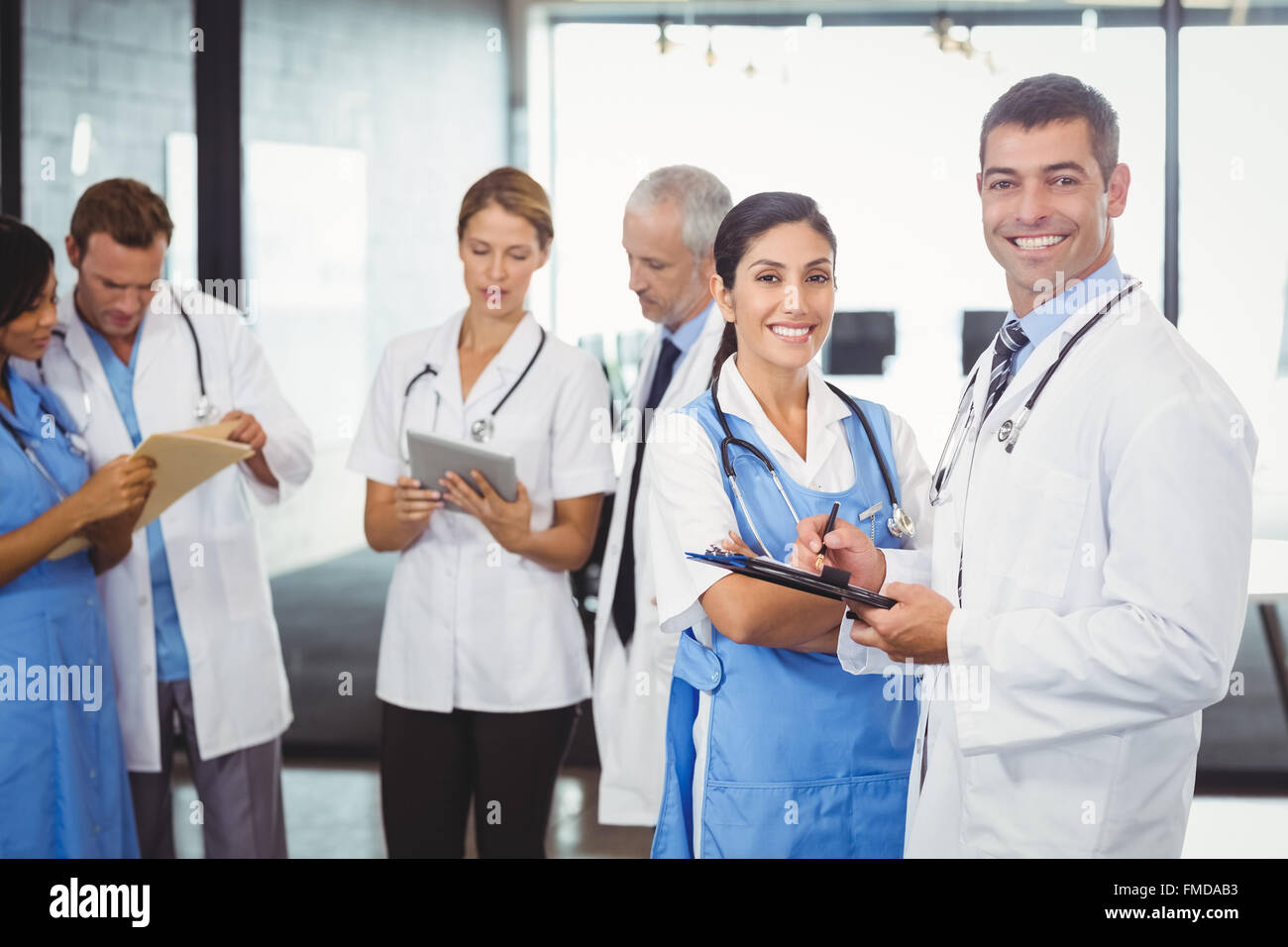 Doctors holding clipboard in hospital Stock Photo - Alamy