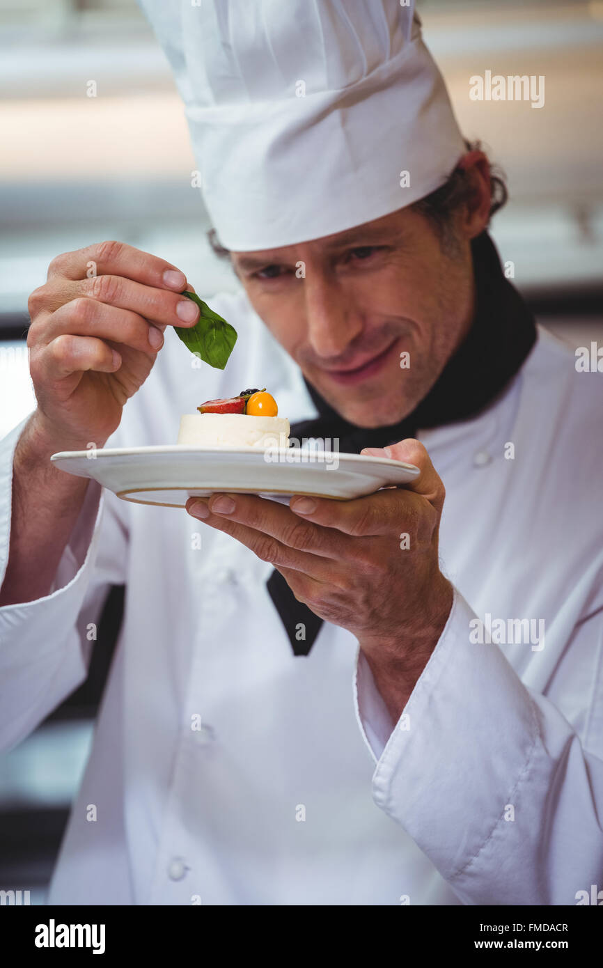 Chef putting finishing touch on dessert Stock Photo - Alamy