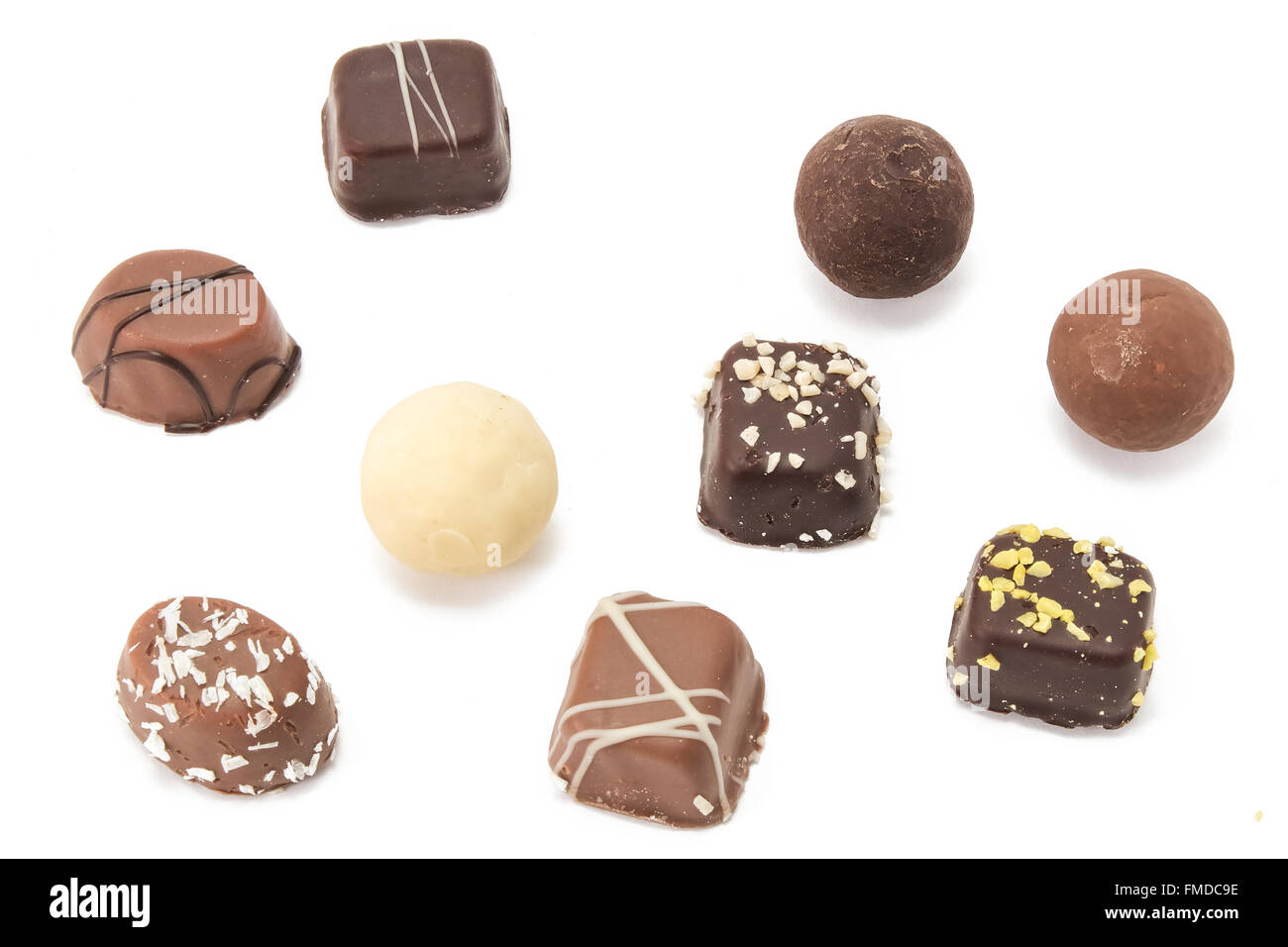 group of filled chocolates standing on a white surface Stock Photo - Alamy