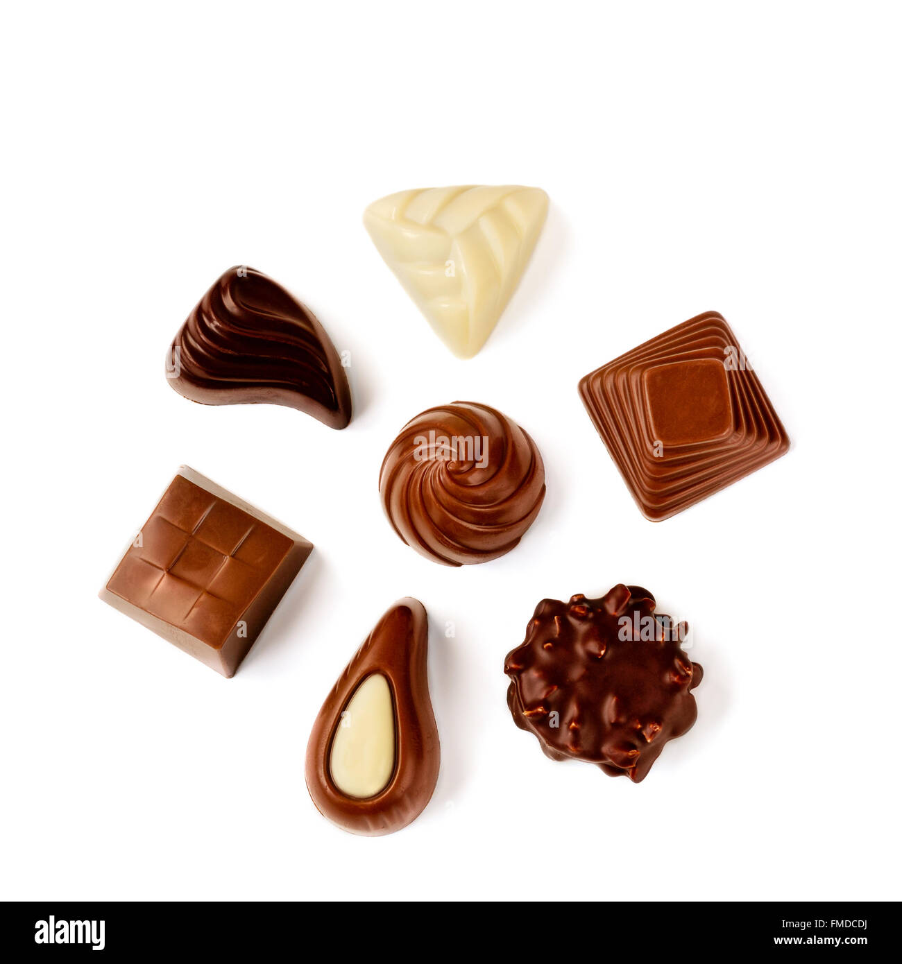White, dark and milk chocolate pralines arranged in circle Stock Photo ...