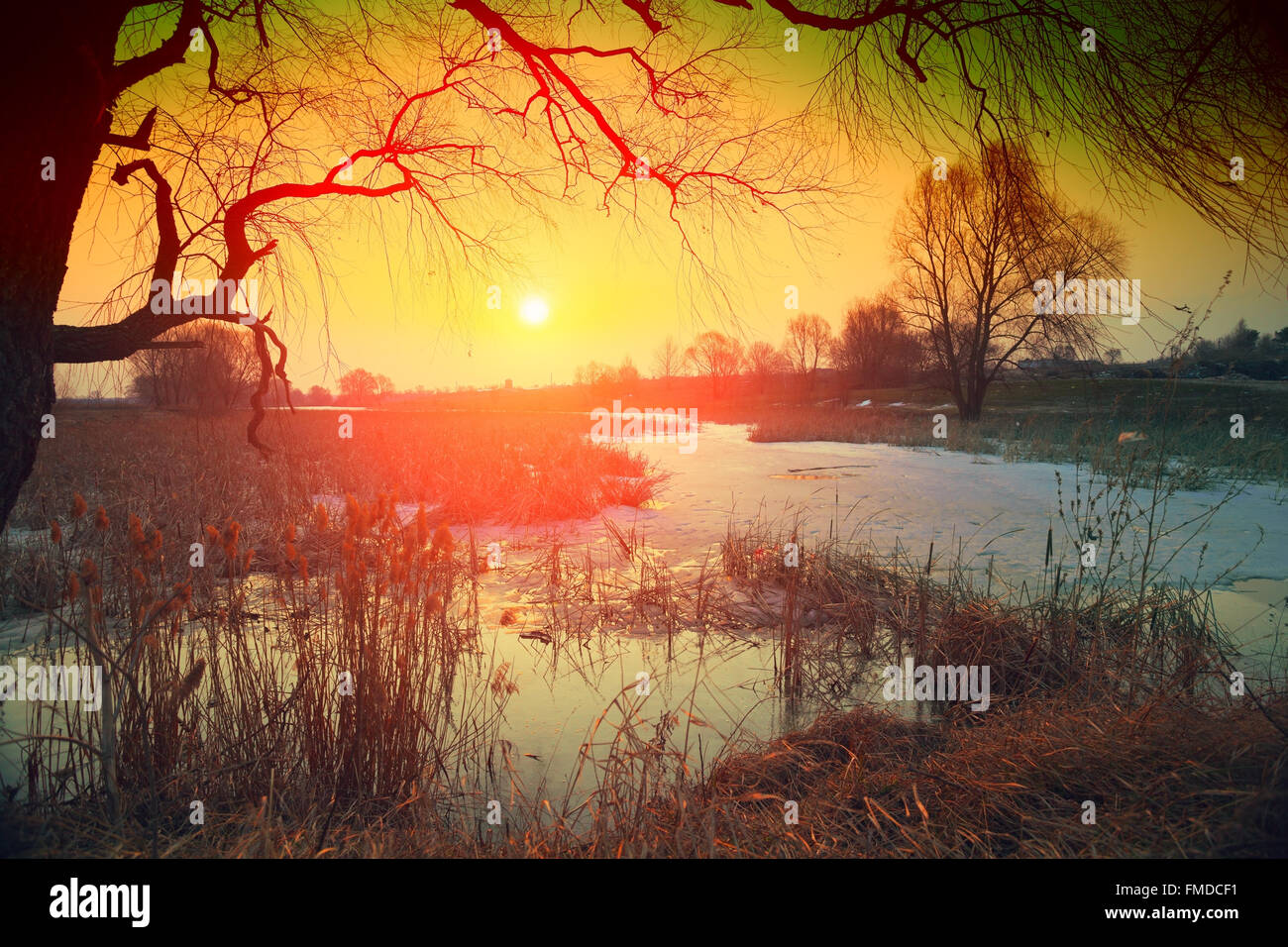 Rural landscape. Sunset over lake Stock Photo - Alamy