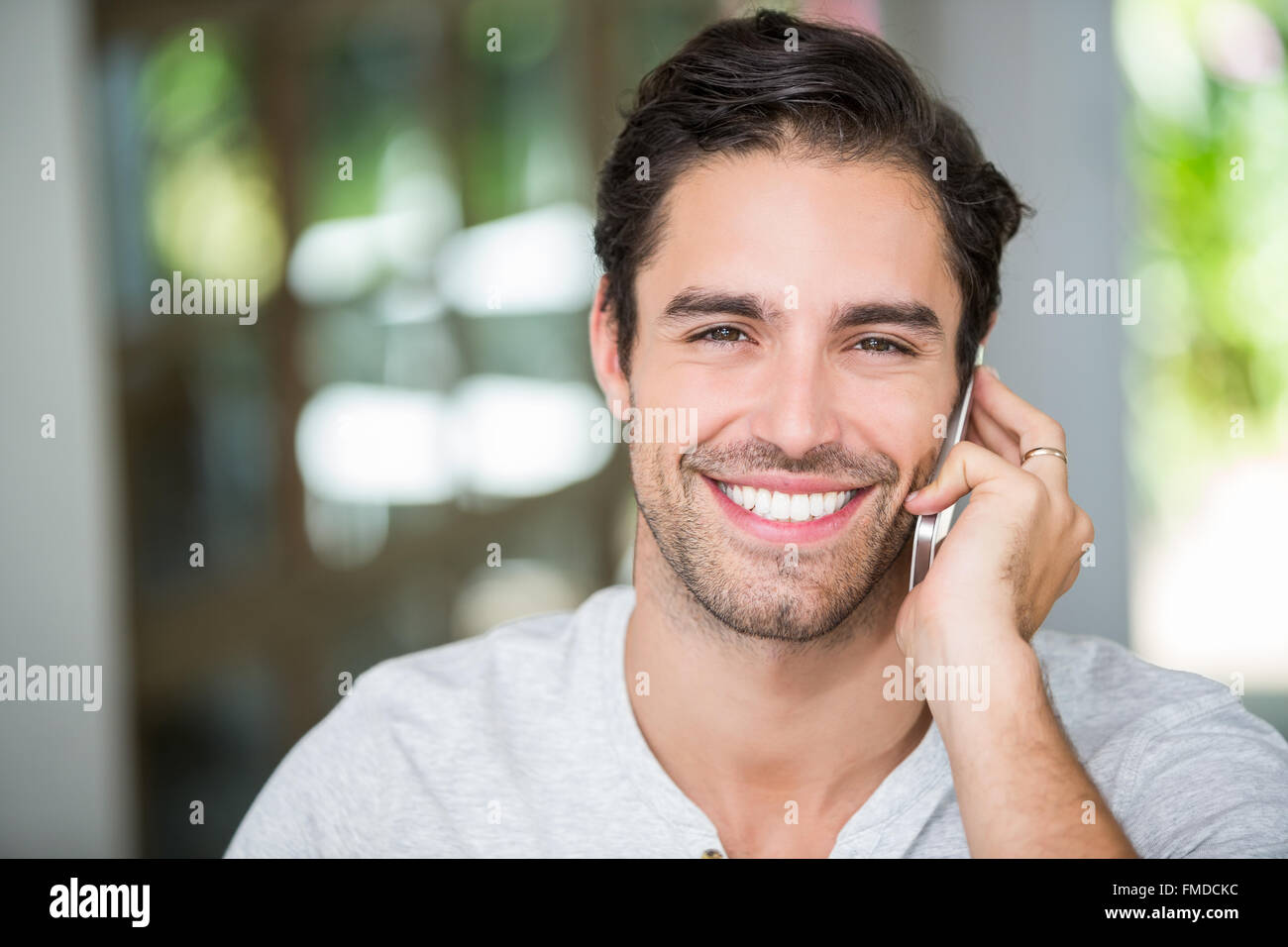 Portrait of man talking on smartphone Stock Photo - Alamy