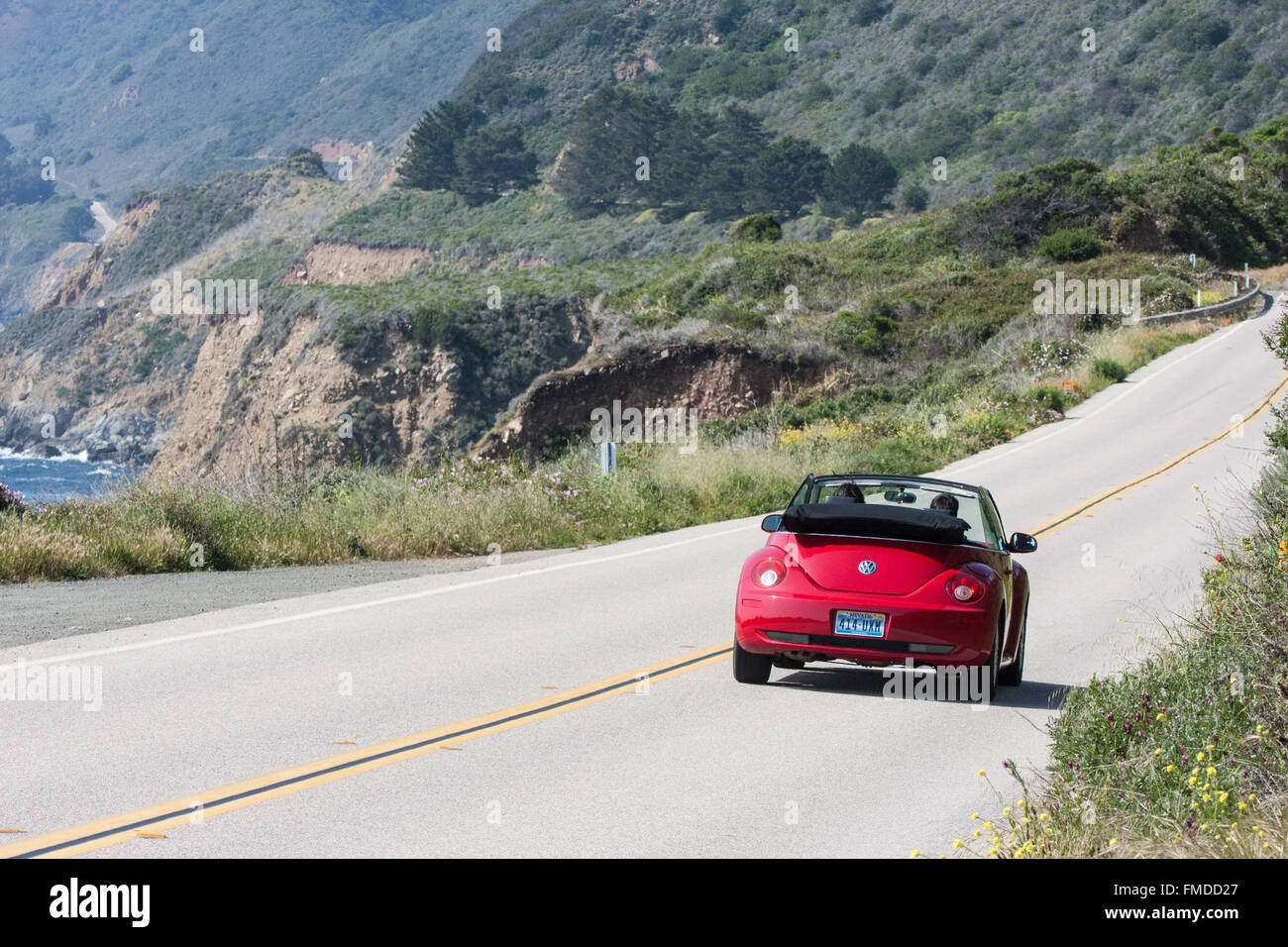 car driving on pacific coast highway,Driving red sports car along ...
