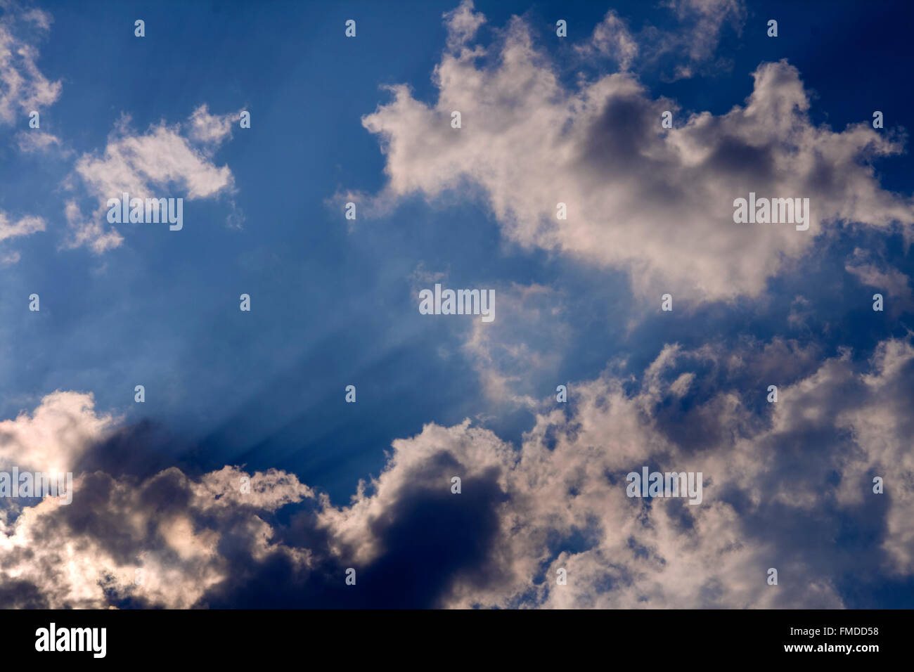 Dramatic storm clouds and rays of sun Stock Photo - Alamy