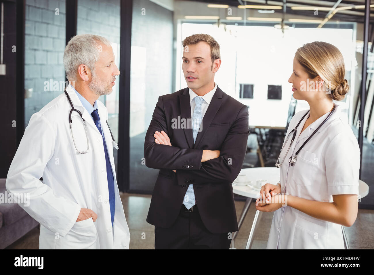 Medical team interacting with each other Stock Photo - Alamy