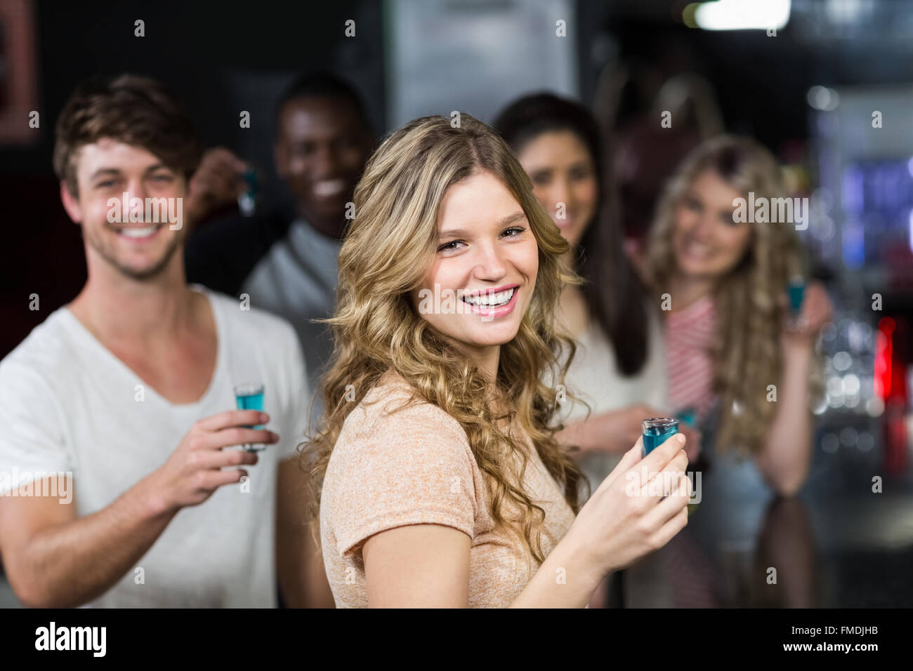 Group of friends having shots Stock Photo - Alamy