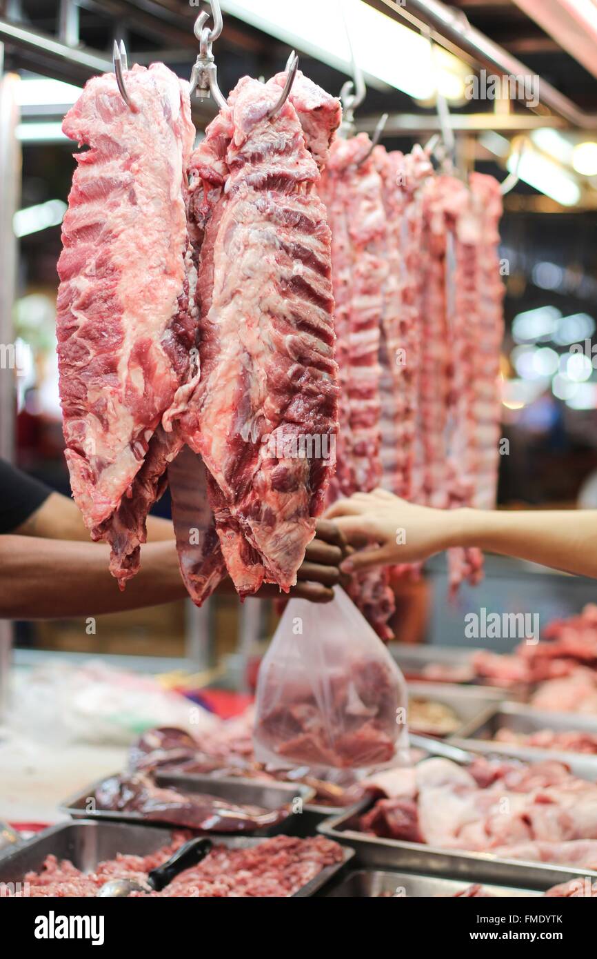 Hanging pork ribs outside at the butcher Stock Photo - Alamy