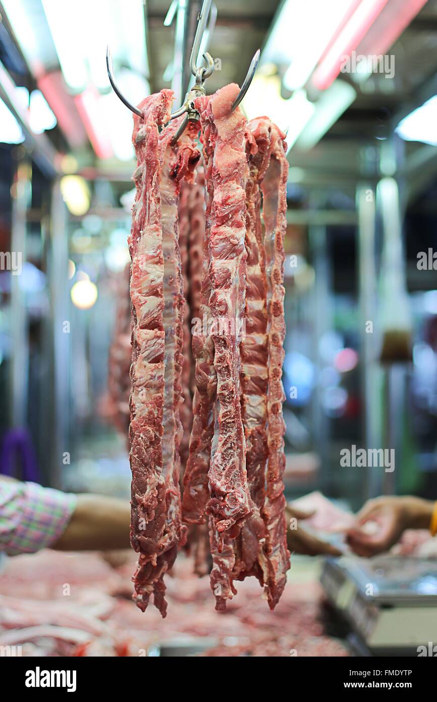 Hanging pork ribs outside at the butcher Stock Photo - Alamy