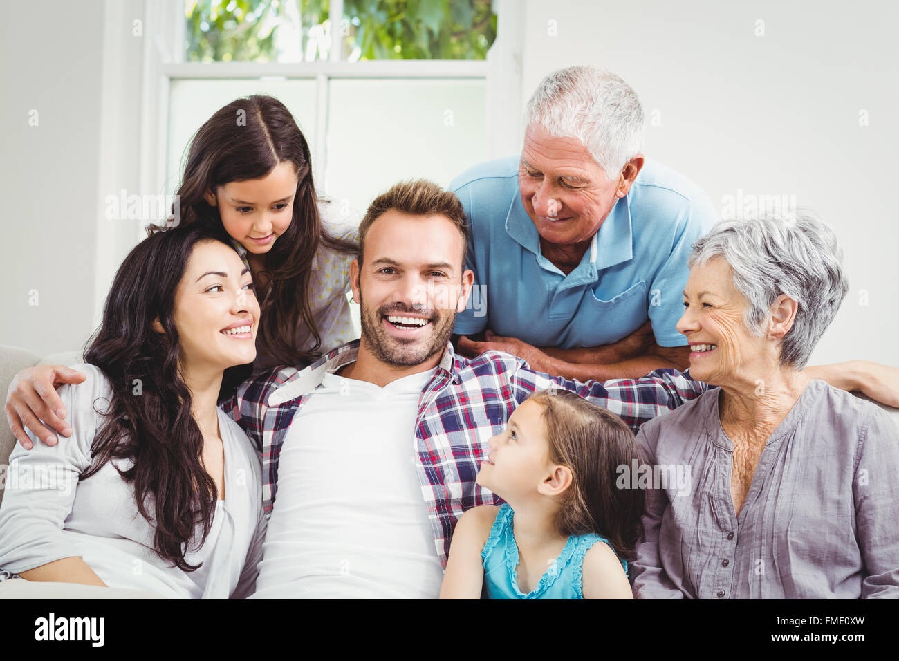 Happy family with grandparents Stock Photo - Alamy