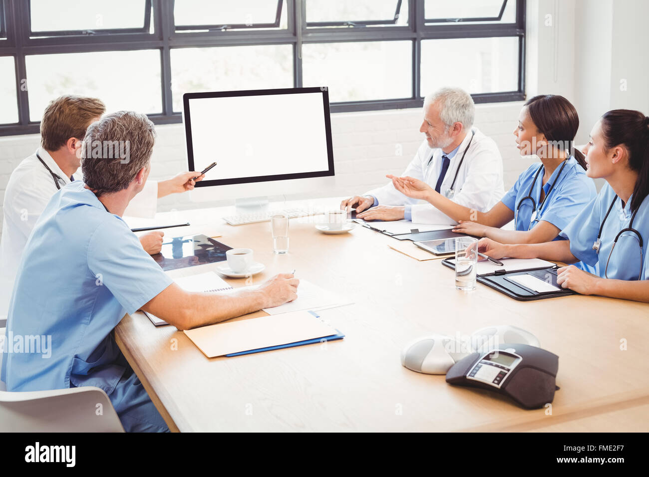 Medical team interacting in conference room Stock Photo - Alamy