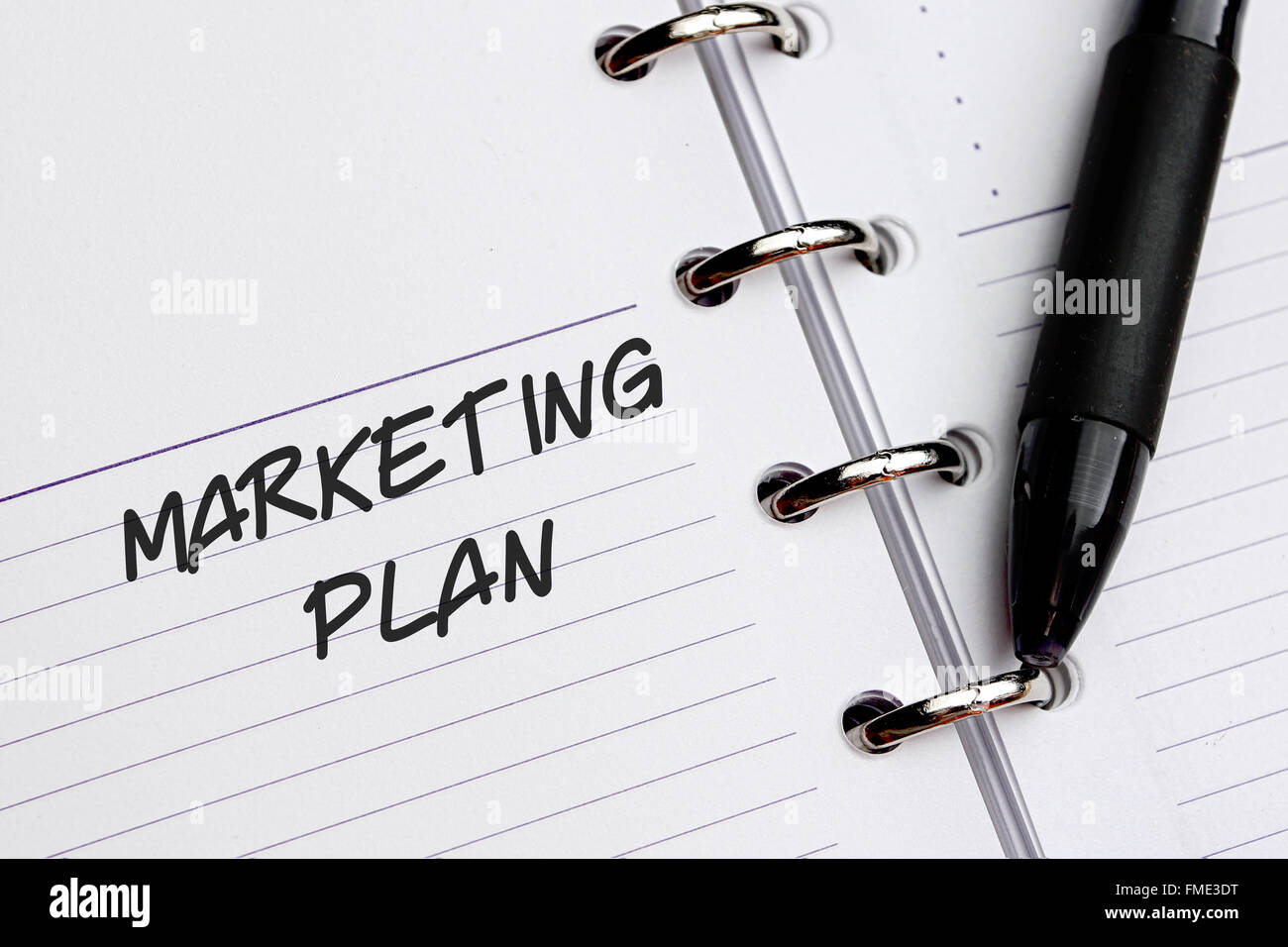 Marketing Plan word written on paper Stock Photo - Alamy