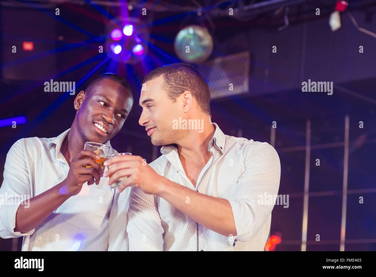 Happy friends toasting with beer and cocktails Stock Photo - Alamy