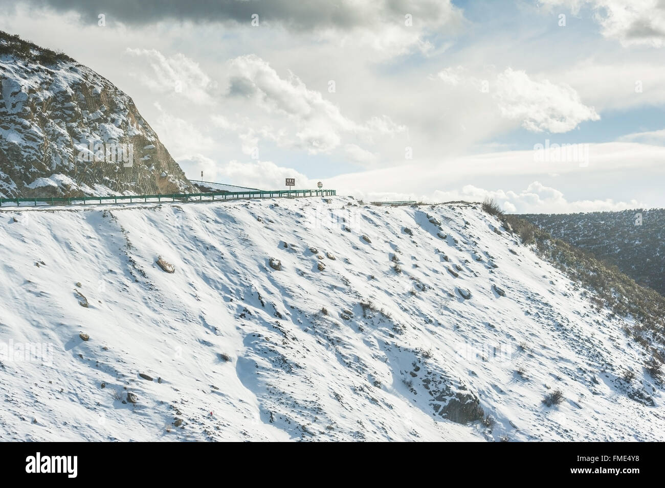 Road in the snow mountains Stock Photo - Alamy