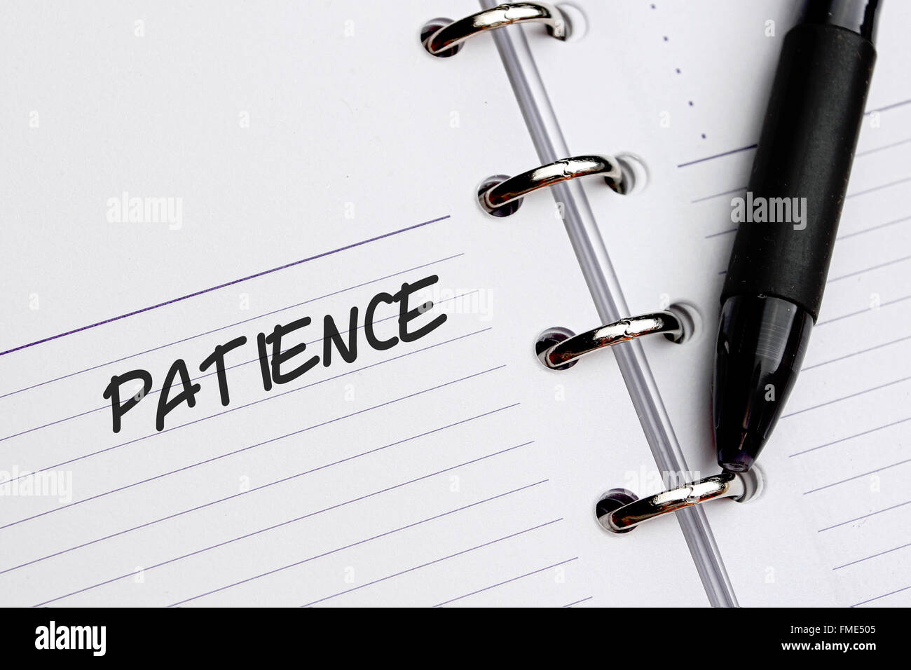 Patience word written on paper Stock Photo - Alamy