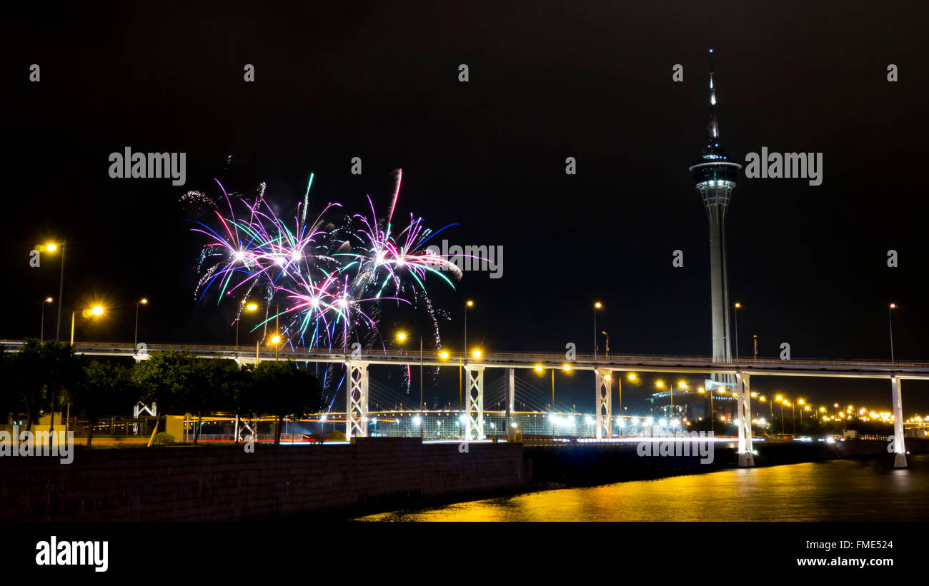 Many fireworks over Macau-Taipa Bridge and Macau Tower during New Years ...