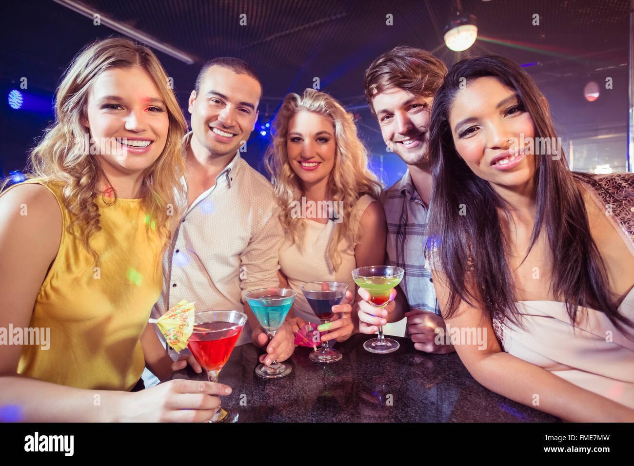 Happy friends with cocktails Stock Photo - Alamy