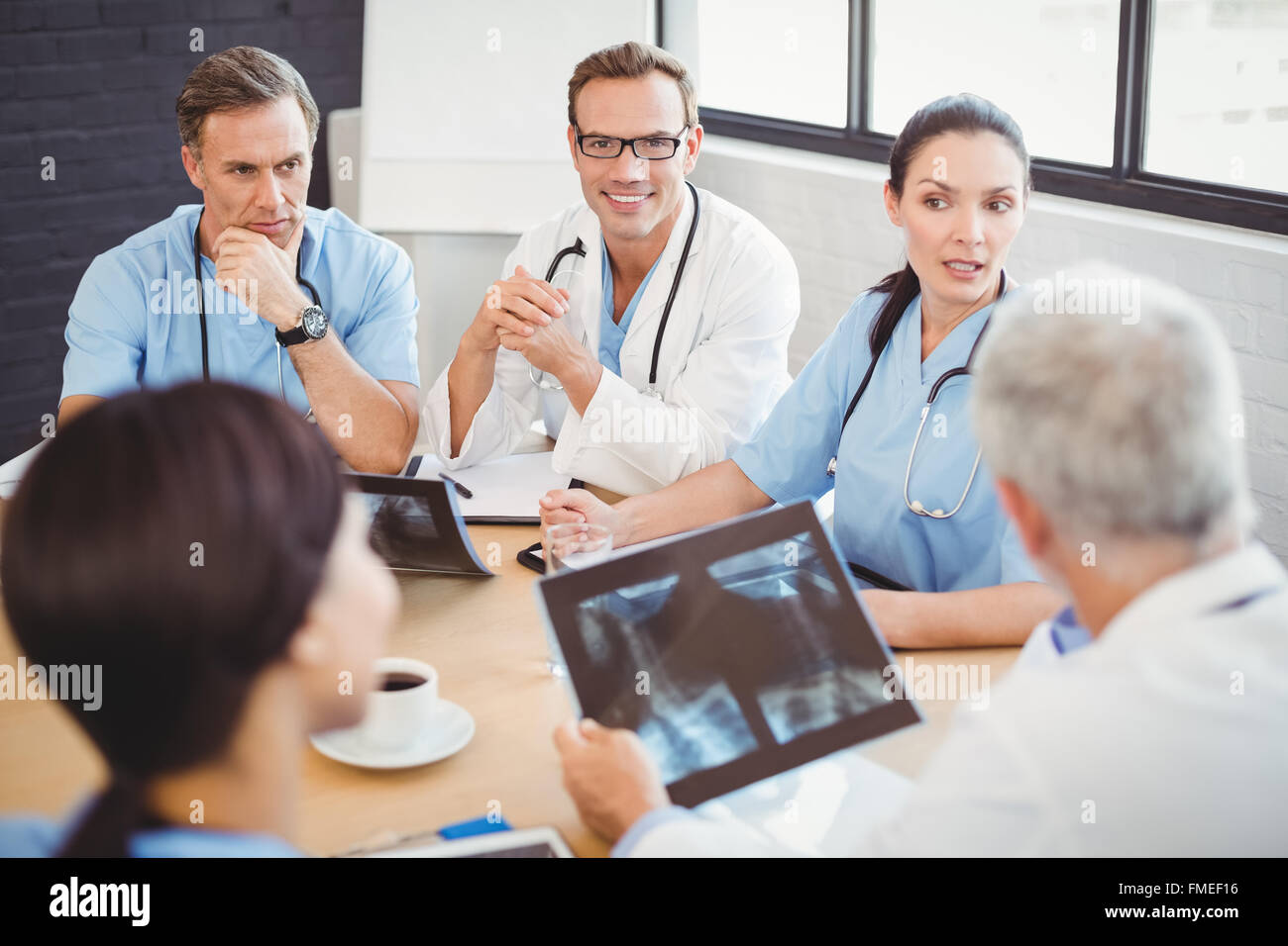 Medical team interacting in conference room Stock Photo - Alamy