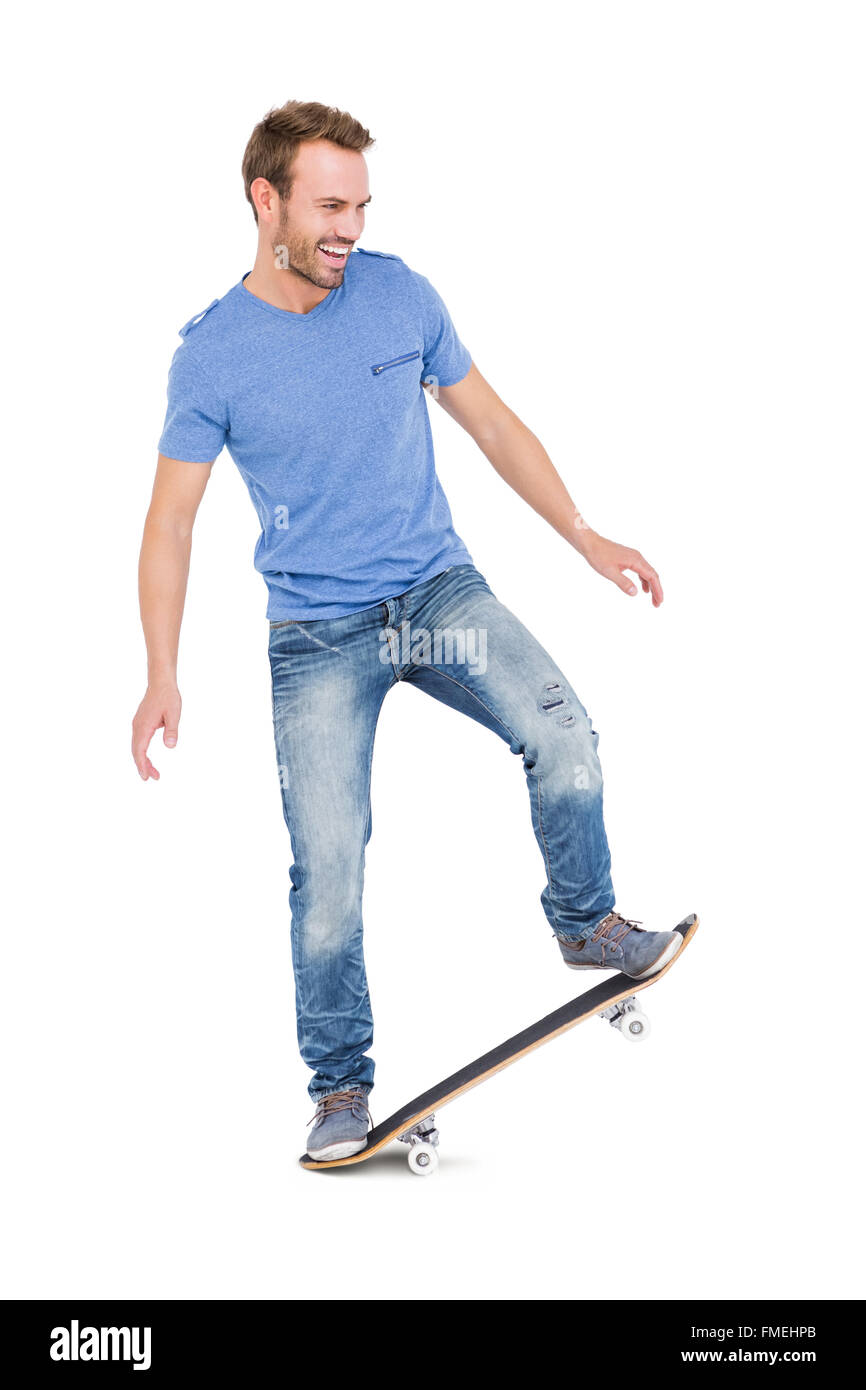 Happy young man skateboarding Stock Photo - Alamy