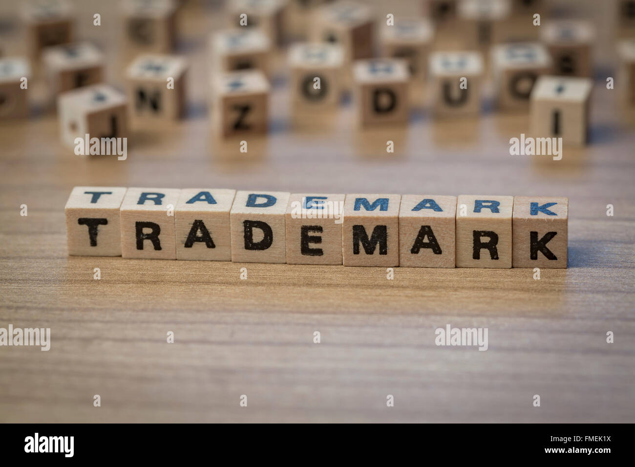 Trademark written in wooden cubes on a table Stock Photo - Alamy