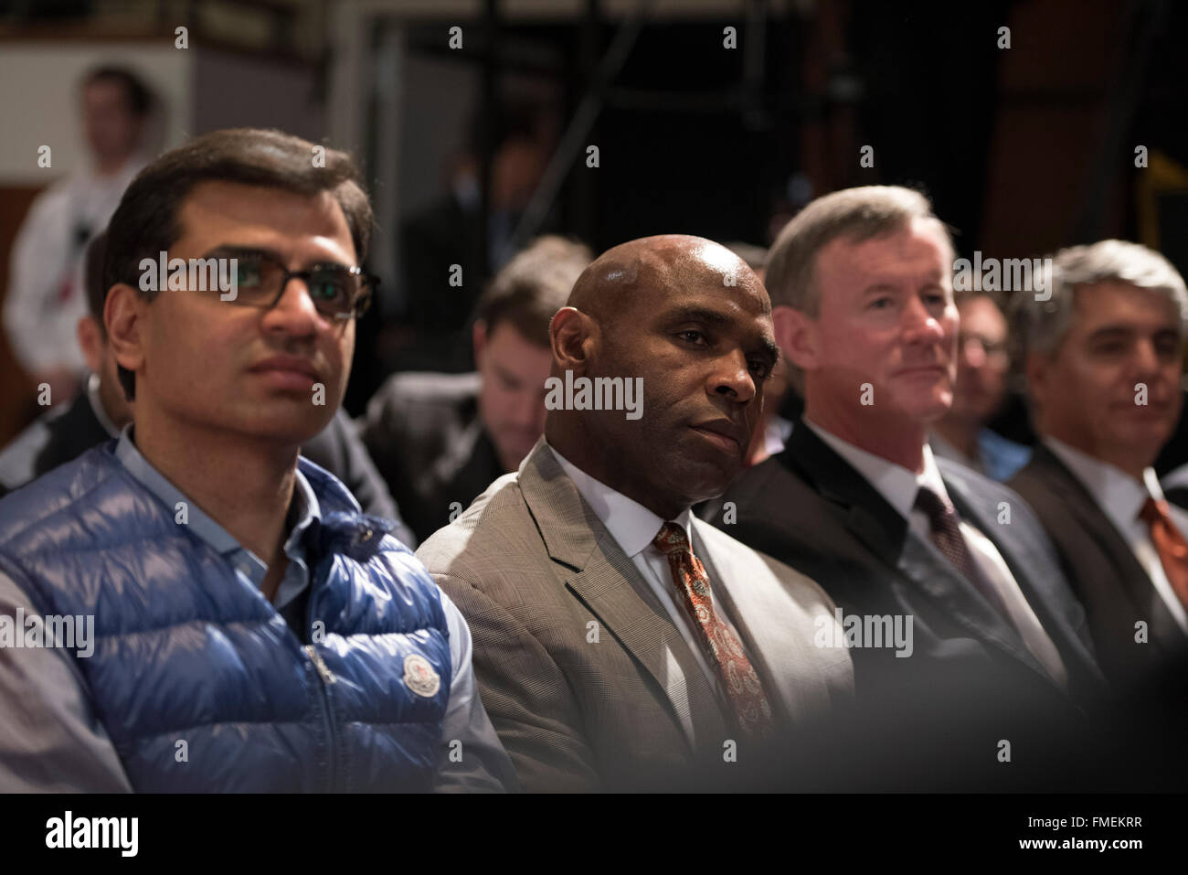 Univ. of Texas football coach Charlie Strong (center) listens to U.S ...