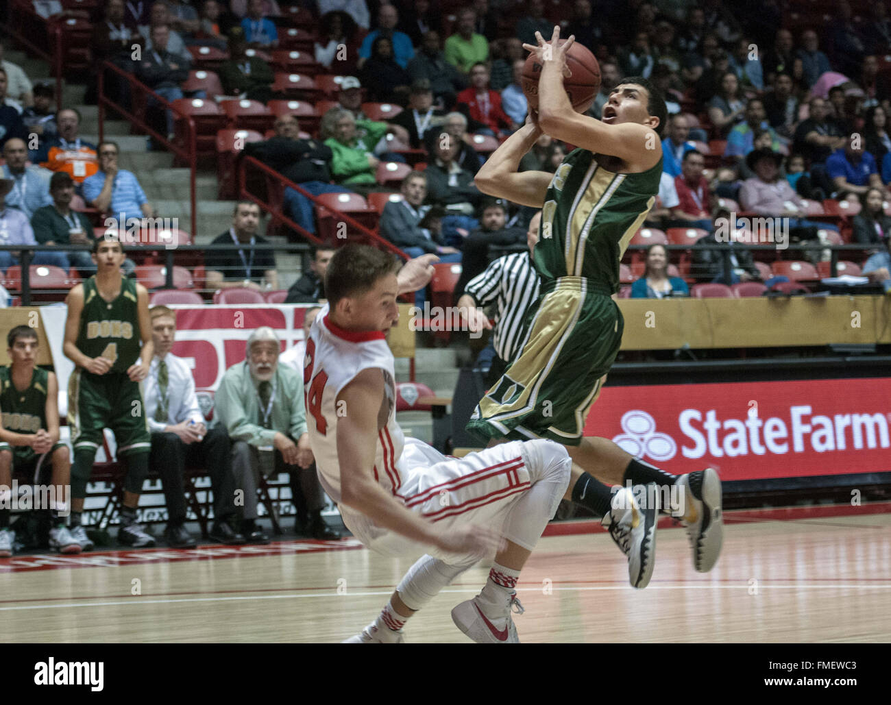 Usa. 11th Mar, 2016. West Las Vegas's Nick Gurule, right, drives to the ...