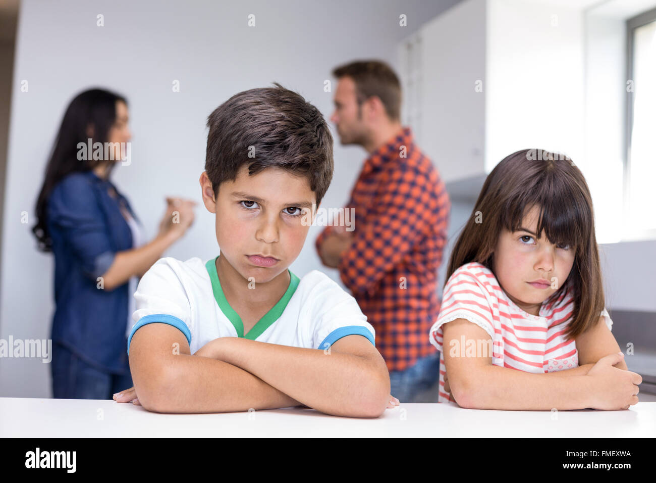 Parents arguing in front of children Stock Photo - Alamy