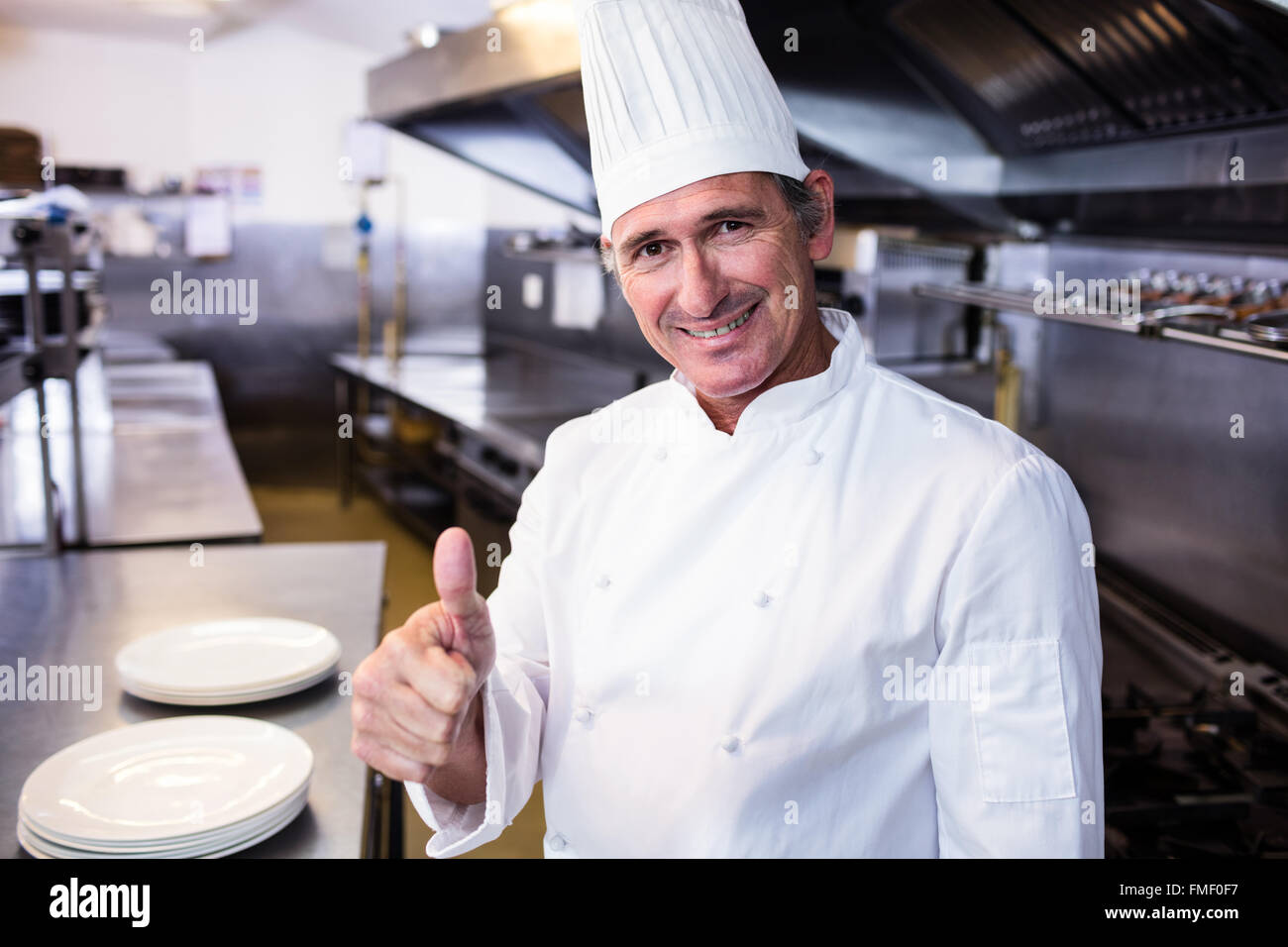Portrait of chef in the kitchen Stock Photo - Alamy