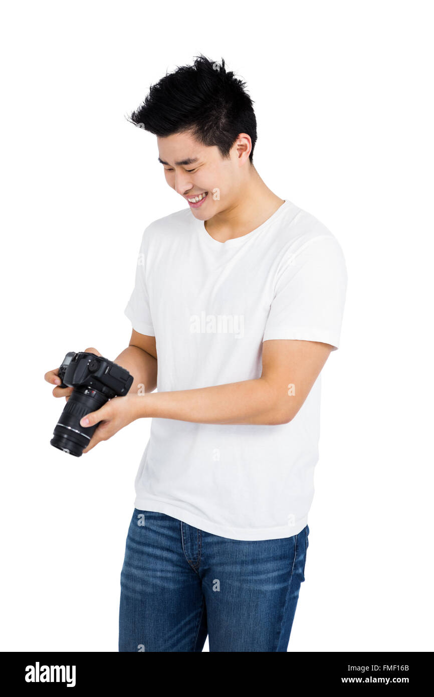 Young man using camera Stock Photo - Alamy